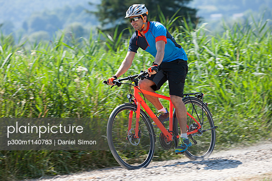 Man on a bicycle tour with trekking bike - Stock Image - Everypixel