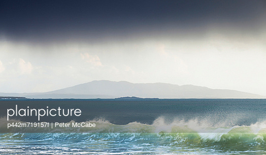 Waves breaking on the rugged irish coastline near county mayo; ireland ...