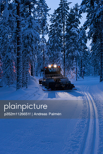 Sweden, Vasterbotten, Umea, Stadsliden, Snowplow in forest - Stock ...