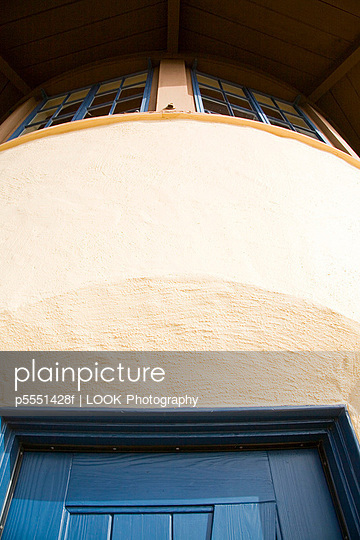 View looking up from a door towards the upper level windows - Stock ...
