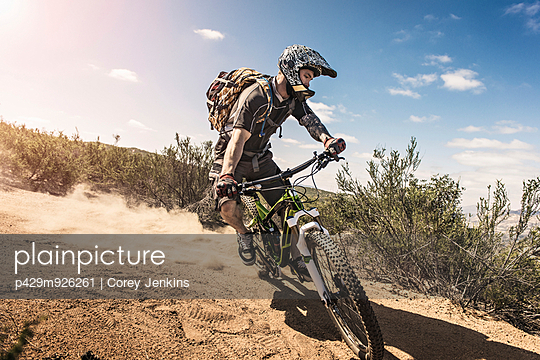 Mountain biker riding downhill - Stock Image - Everypixel