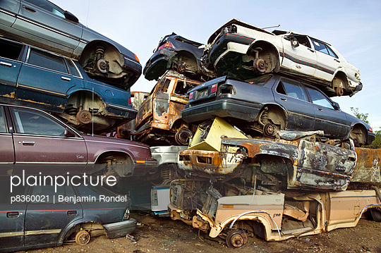 Cars piled up at a junk yard - Stock Image - Everypixel