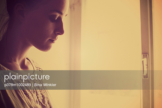 Woman next to window - Stock Image - Everypixel