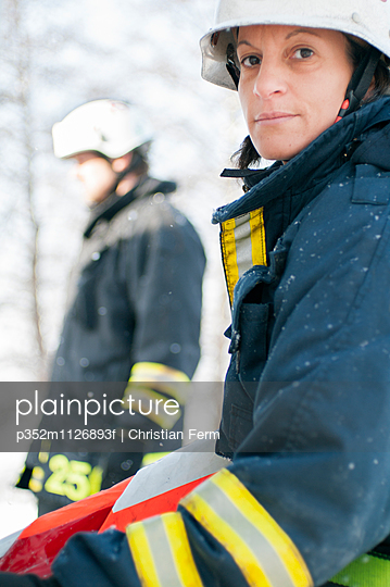 Sweden, Sodermanland, Firefighters wearing uniform in winter - Stock ...