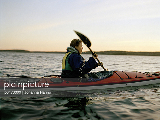 Woman Rowing Kayak In Sea - Stock Image - Everypixel