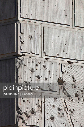 Bullet holes over facade of old building - Stock Image - Everypixel