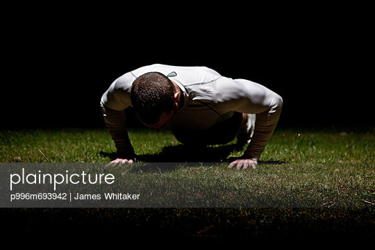 Man Doing Press-Ups In The Dark - Stock Image - Everypixel