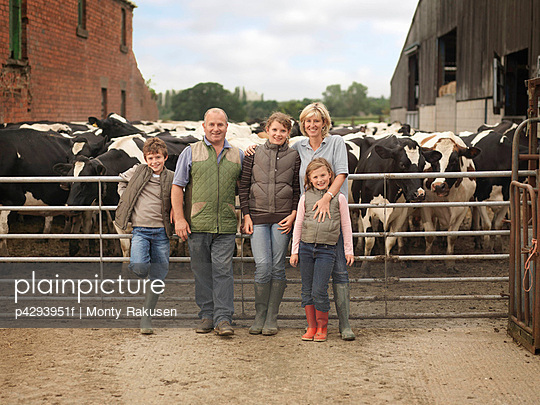 Farmer And Family With Cows - Stock Image - Everypixel