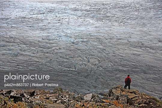 Man Looking Out Over Glacier, Iceland - Stock Image - Everypixel