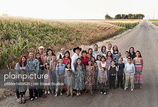 Family smiling together on rural road - Stock Image - Everypixel
