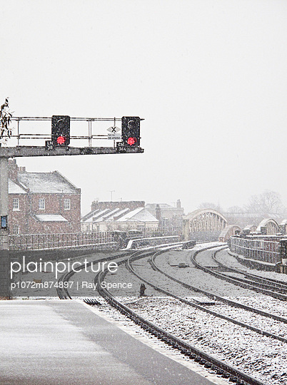 railway platform, signals and tracks in snow - Stock Image - Everypixel