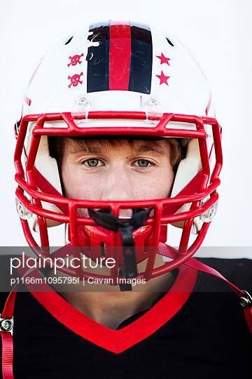 Studio portrait of football player (16-17) - Stock Image - Everypixel
