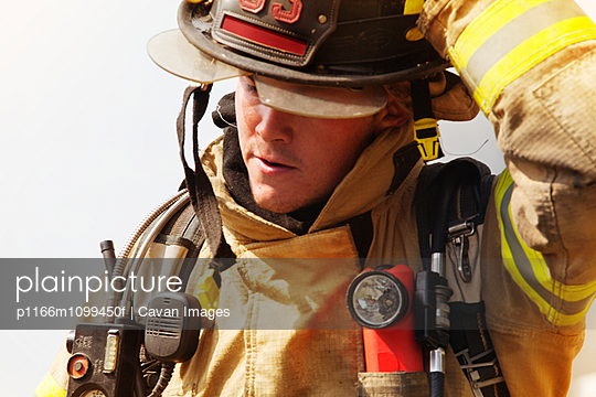 Firefighter looking down - Stock Image - Everypixel