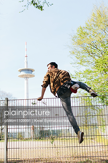 Climbing over fence Images - Search Images on Everypixel