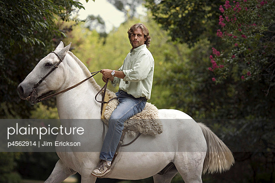 Man riding a white horse - Stock Image - Everypixel